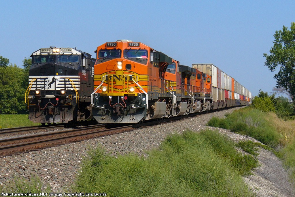 BNSF 7730 west passes NS 9036